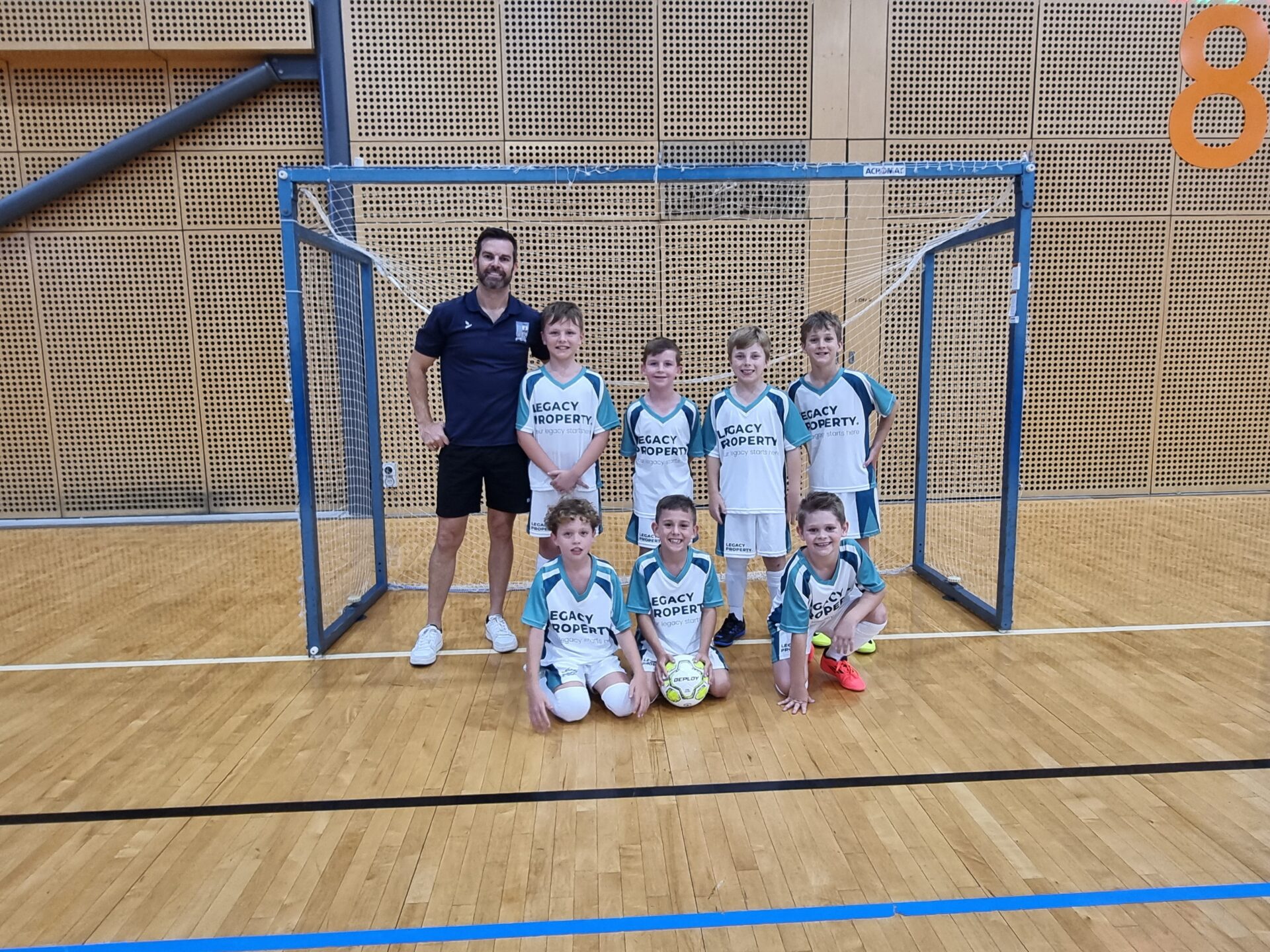 Grass Roots Program: Pacific Pines Under 9s Futsal Team - Sevenfold Property Group